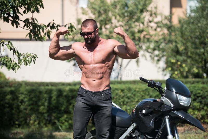 Muscular Man and Motorcycle Stock Photo - Image of motor, biker: 49608724