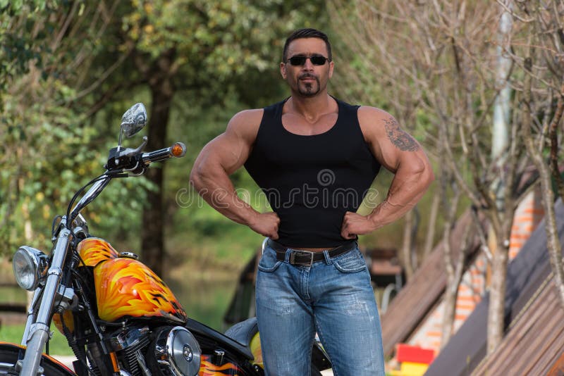 Bodybuilder and Motorcycle stock photo. Image of chrome - 49608716