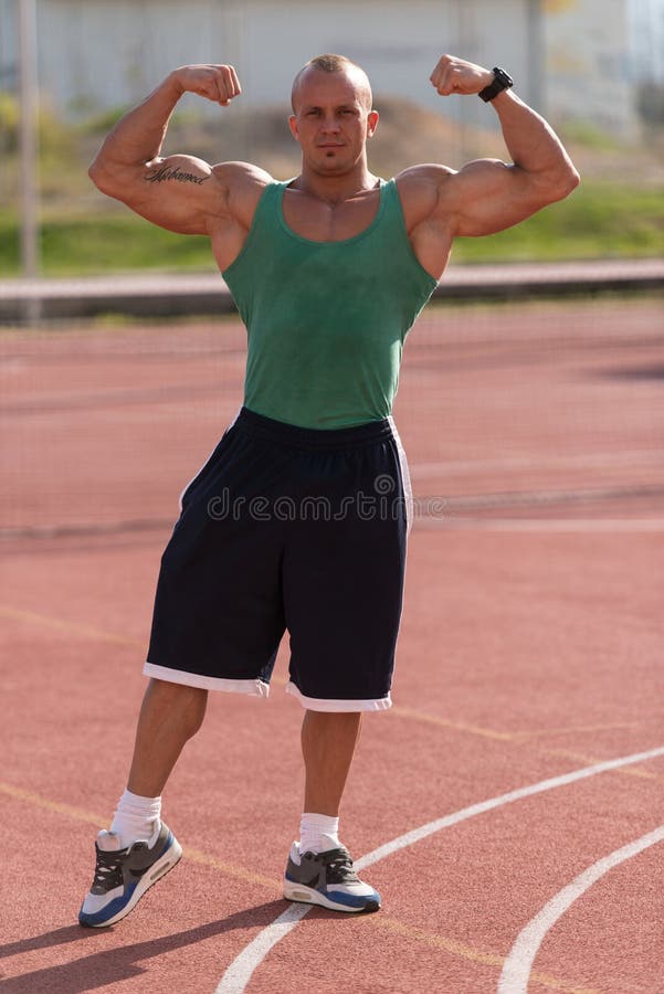 Bodybuilder Performing Quarter Turn Right Pose Stock Image - Image of ...