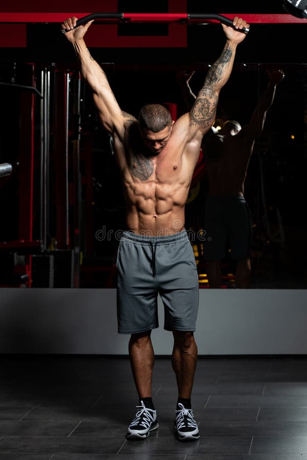 Bodybuilder Performing Hanging Leg Raises Exercise Ab Exercises Stock ...