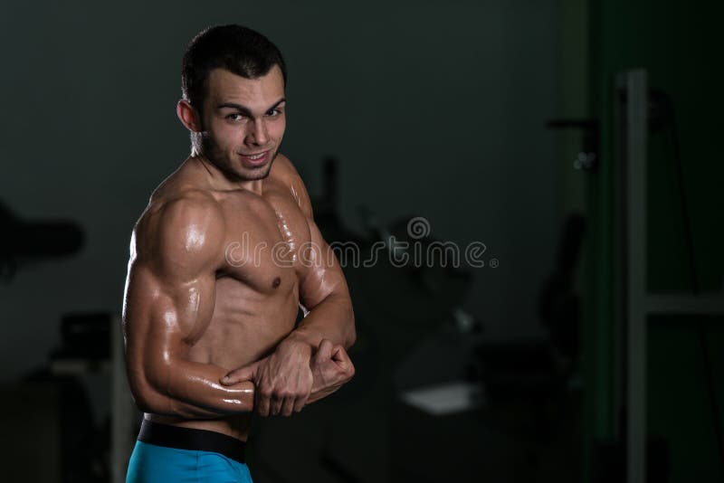 Bodybuilder Performing Side Chest Poses Stock Photo - Image of human ...