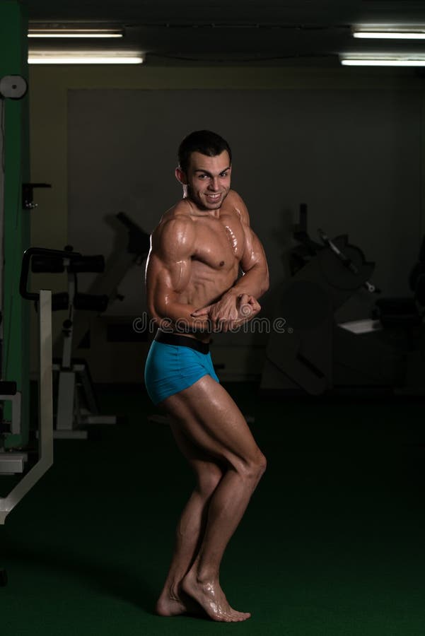 Bodybuilder Performing Side Chest Poses Stock Image - Image of ...