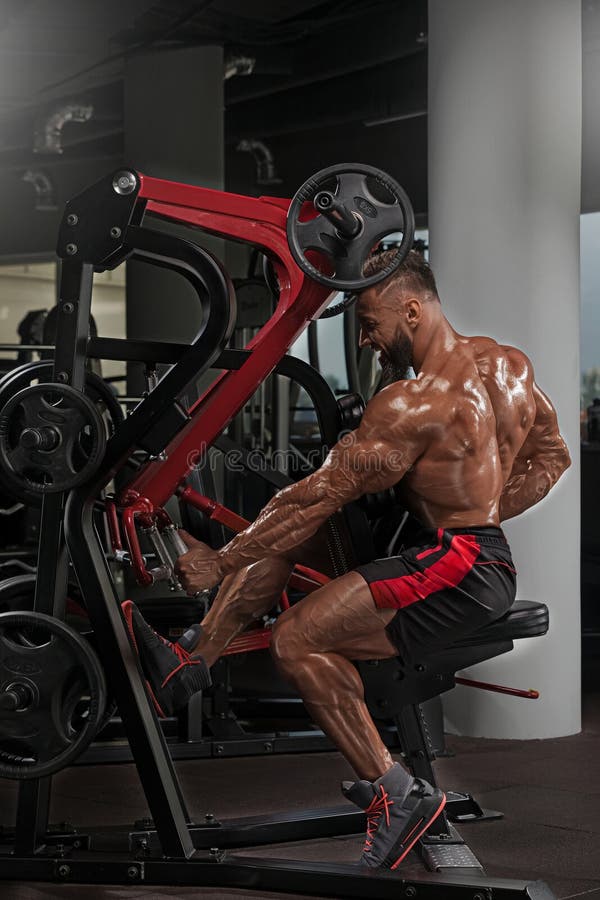 Bodybuilder Performs Seated Machine Workout Targeting Back Muscles in ...