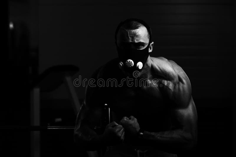 Bodybuilder Posing after Exercises in Elevation Mask Stock Image ...