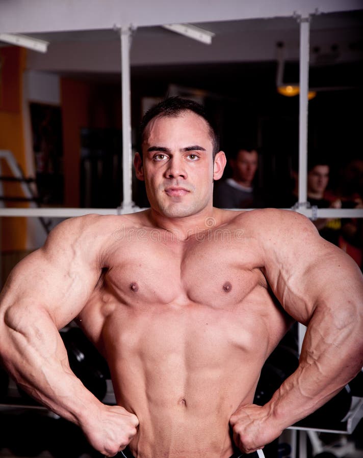 Bodybuilder posing stock photo. Image of bodybuilder - 30549606