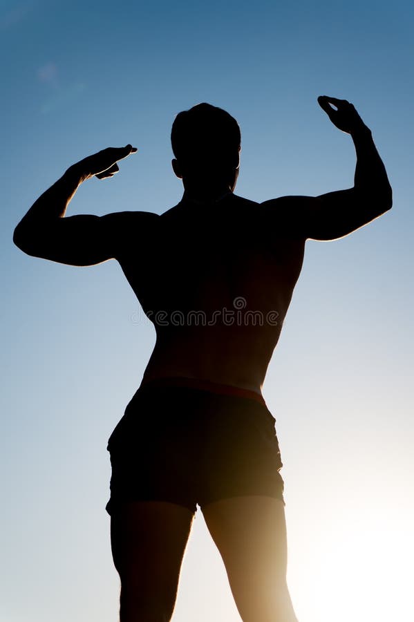 Bodybuilder Posing on Sky and Sun Light, Back View Stock Photo - Image ...