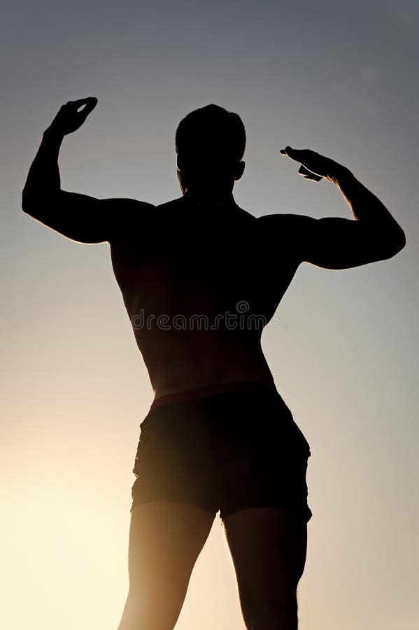 Bodybuilder Posing on Sky and Sun Light, Back View Stock Photo - Image ...