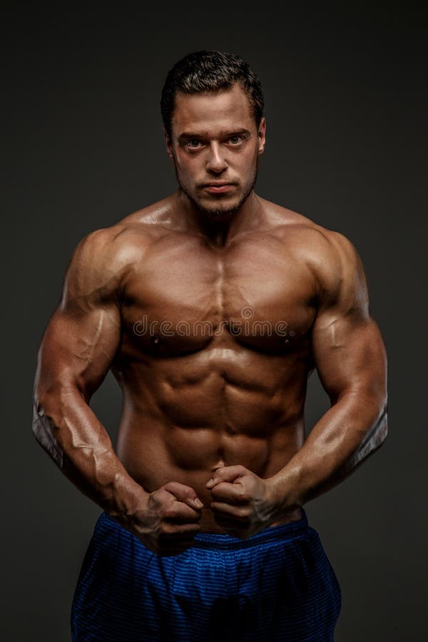 Awesome Muscular Guy Posing in Studio. Stock Photo - Image of energy ...