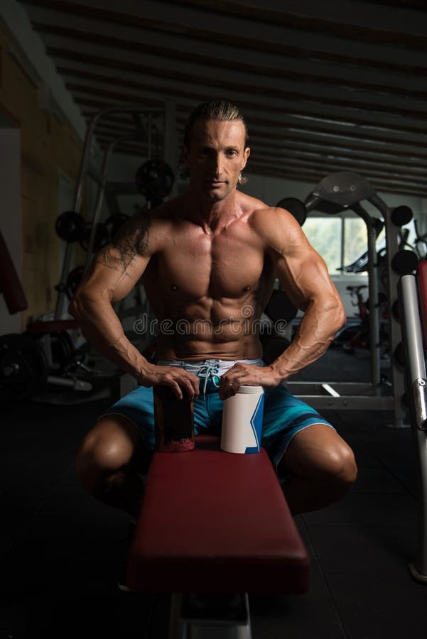 Bodybuilder Posing with Supplements for Copy Space Stock Image - Image ...