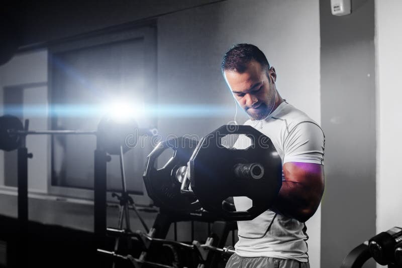 Bodybuilder Man Pumping Muscles and Posing in Ripped Shirt Stock Photo ...