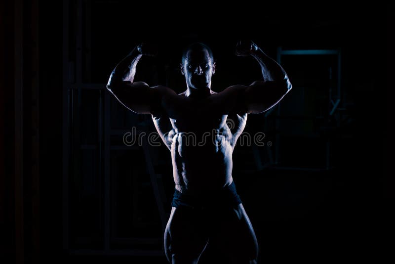 Bodybuilder Standing in the Gym and Flexing Muscles Stock Photo - Image ...