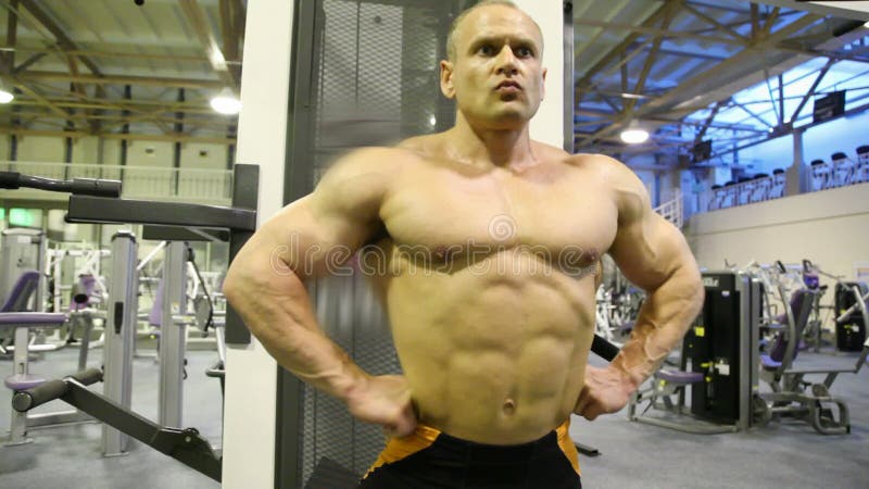 Bodybuilder Straining Muscles in Stock Footage - Video of perform ...