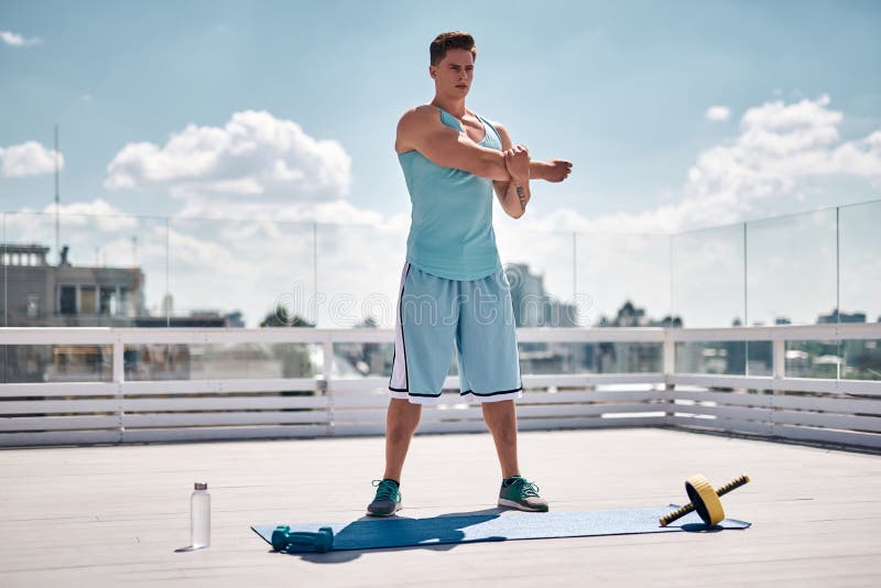 Bodybuilder is Stretching Arm after Work Out Outside Stock Image ...