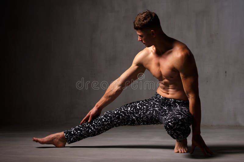 A Guy in a Great Sports Uniform in the Studio on a Gray Background ...