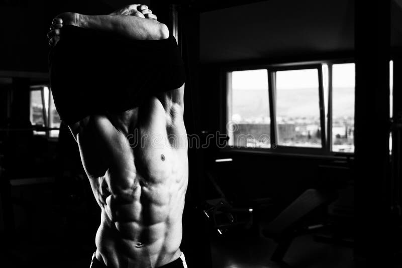 Bodybuilder Taking His Shirt Off after Training Stock Photo - Image of ...