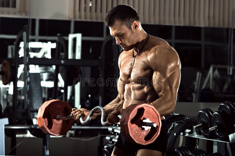 Male Bodybuilder Resting after Doing Heavy Weight Exercise Stock Photo ...