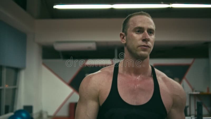 Bodybuilder walking in gym stock footage. Video of light - 117680288