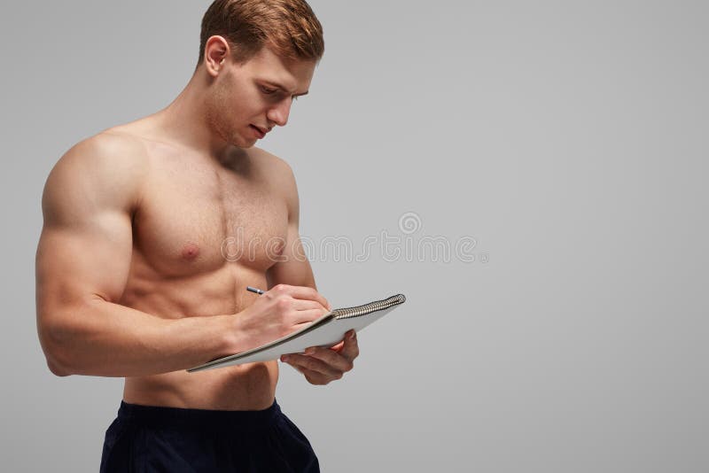 Bodybuilder Writing in Notepad Stock Image - Image of activity ...