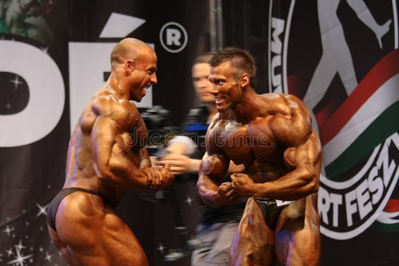 Bodybuilders posing editorial photo. Image of exercise - 16597166