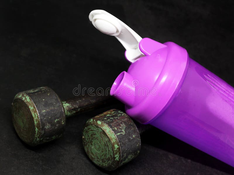 Bodybuilding Components: Purple Protein Shake with a Dumbbell Stock ...