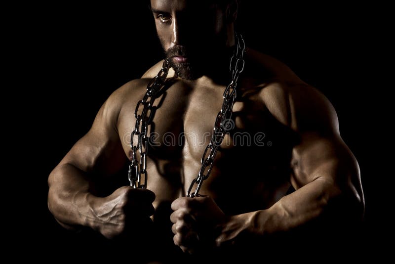 Muscular Man with Chains on Black Background Stock Photo - Image of ...