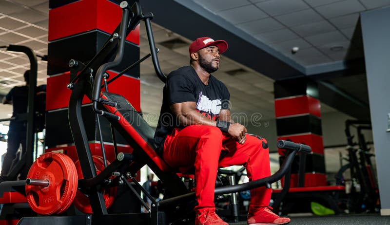 Bodybuilding Training in Gym. Guy Working Out in Modern Gym Stock Image ...