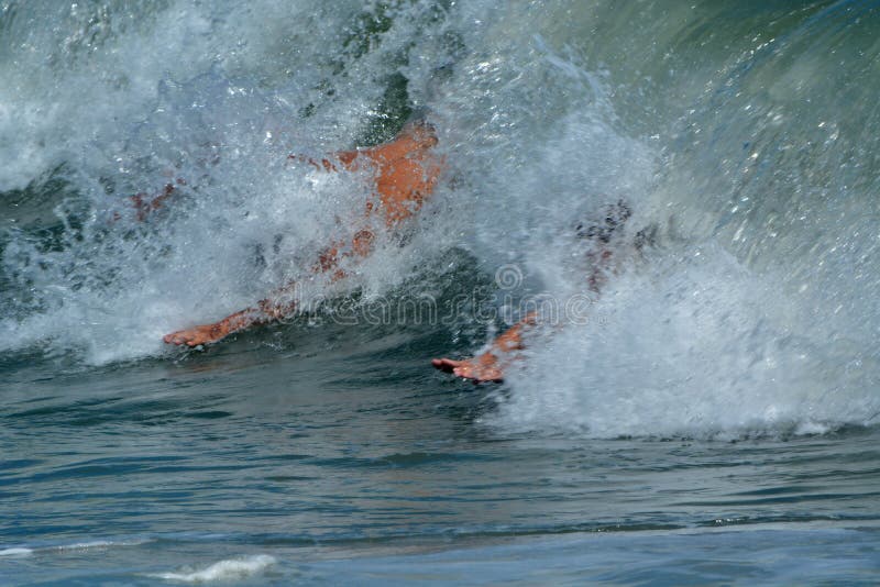 Bodysurfers Catching a Wave Stock Image - Image of catch, high: 77731745