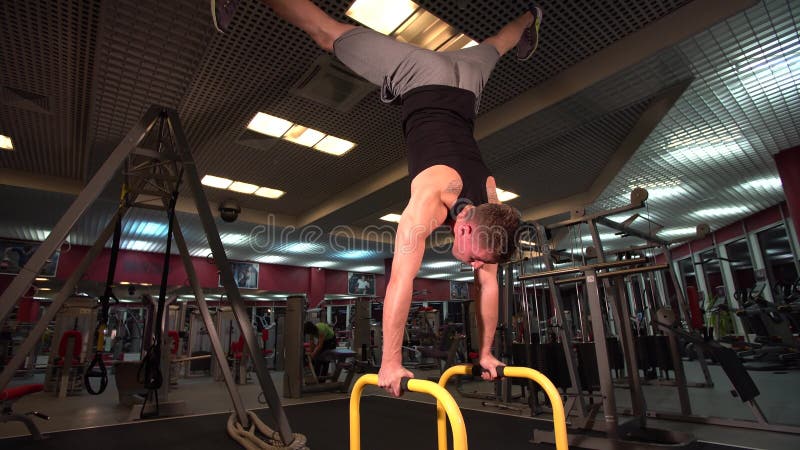 Bodyweight Exercise, Man Standing on Hands at Gym Stock Footage - Video ...