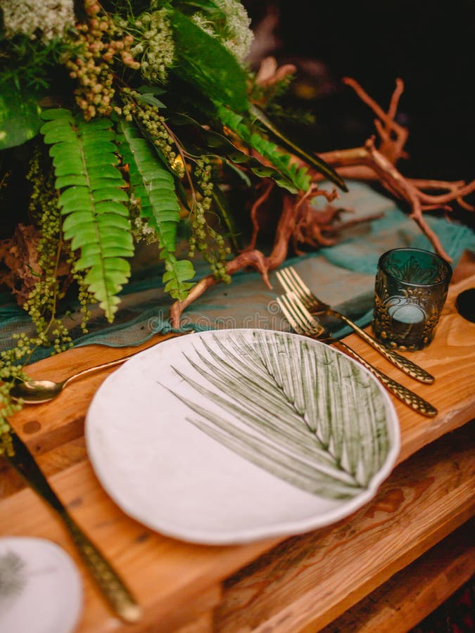 Boho Table Setting with a Blank Card Decorated with Fern Branches Close ...