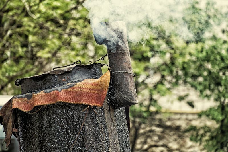 Boil with Boiling Resin. Iron Barrel Filled with Resin Stock Photo ...