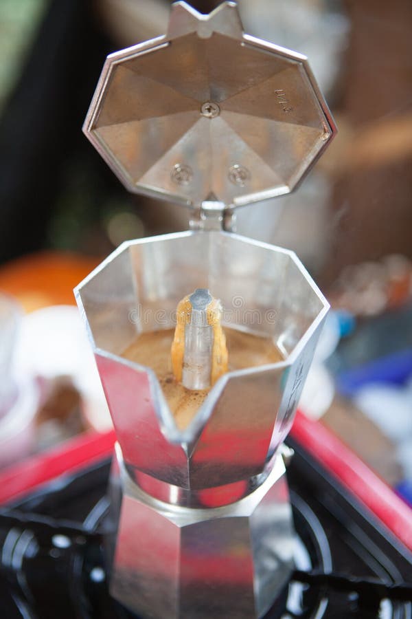 Boil coffee in mokka pot stock image. Image of water - 98343703