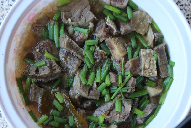 Boil in a Cow in a White Cup. Stock Photo - Image of beef, knee: 87457020