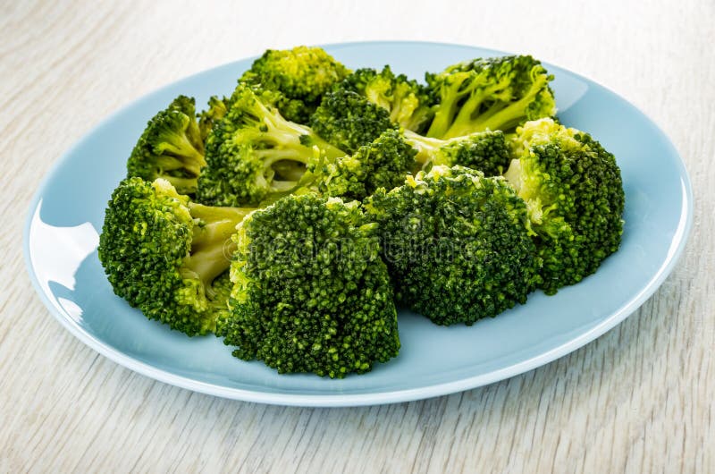 Boiled Broccoli in Blue Plate on Wooden Plate Stock Image - Image of ...