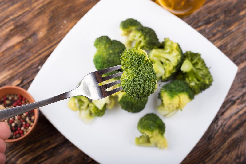 Boiled broccoli on a plate stock photo. Image of meal - 79368702