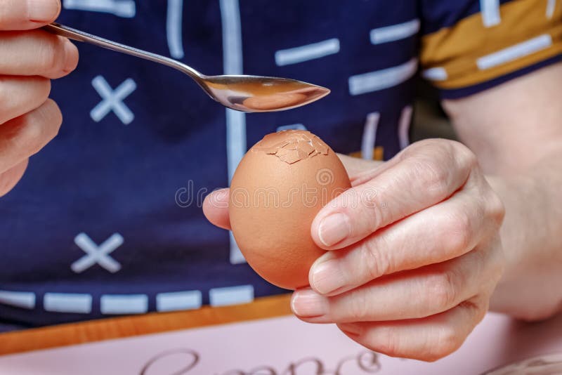 Boiled Brown Chicken Egg with Broken Shell on the Top by Teaspoon in ...