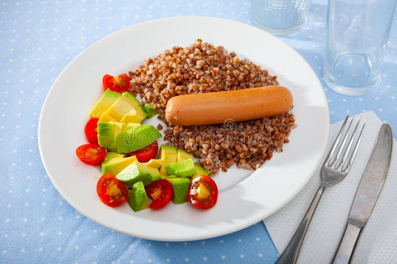 Boiled Buckwheat Cereal in Plate Stock Photo - Image of diet, tomatoes ...