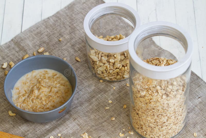 Boiled Cereals on Milk and the Cashews Strewed with Stock Photo - Image ...