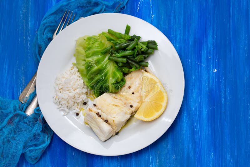 Boiled Cod Fish with Rice and Vegetables on White Plate Stock Photo ...