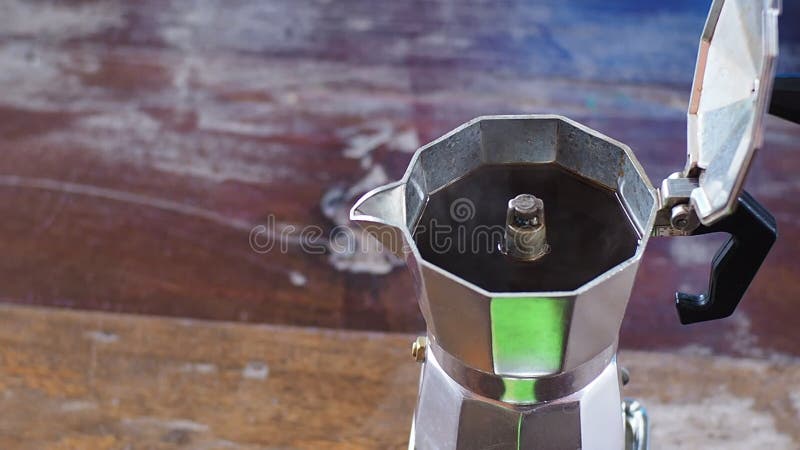 Boiled Coffee in Coffee Pot and Smoke Coffee on the Pot a Wood Pattern ...