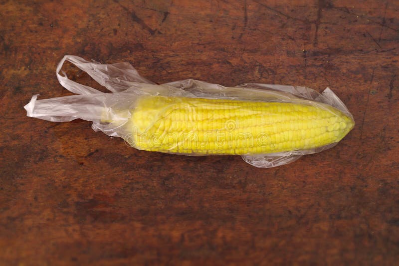 Boiled Corn in Plastic Bags, Placed on Wooden Floors and Bright ...