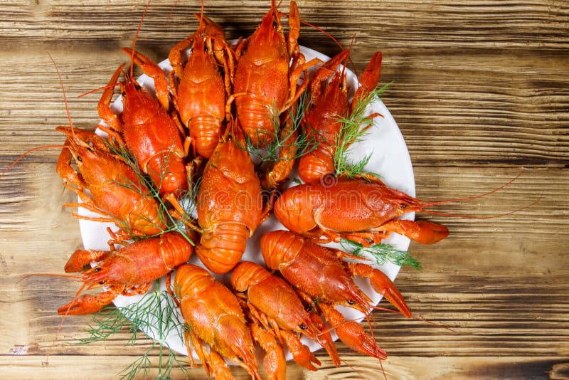Boiled Crayfish in Plate on Wooden Table. Top View Stock Photo - Image ...
