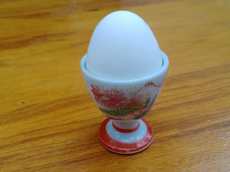 Delicate Boiled Egg Holder on the Wooden Table Stock Photo - Image of ...