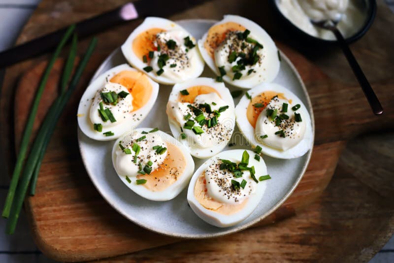 Boiled Egg Halves with Mayonnaise and Green Onions Stock Photo - Image ...