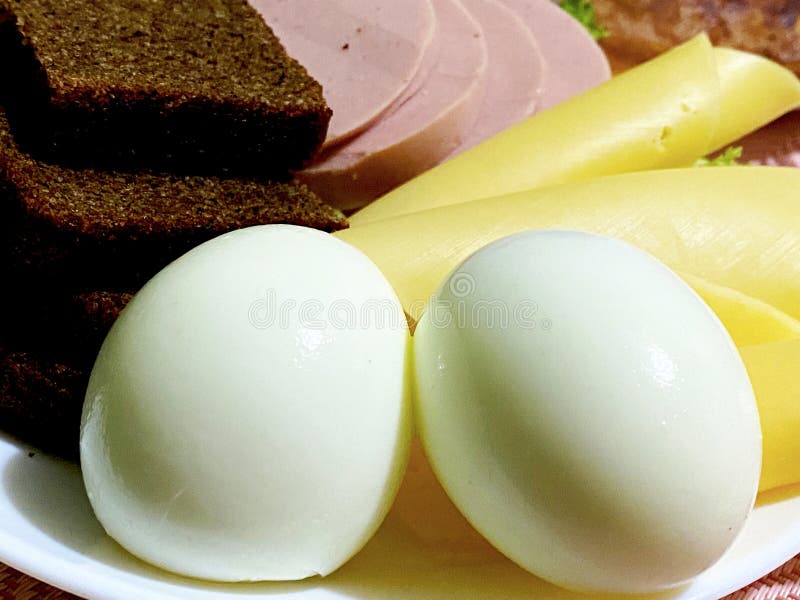 Boiled Eggs and Cheese on a Plate Stock Photo - Image of shell, brown ...