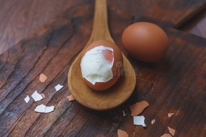 Boiled Eggs with Shells Removed on a Wooden Spoon Stock Photo - Image ...