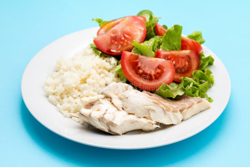 Boiled Fresh Fish with Boiled Rice and Fresh Salad Stock Photo - Image ...