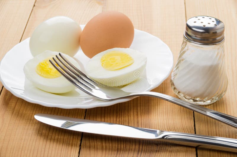 Boiled Full Eggs and Half of Eggs in White Plate Stock Photo - Image of ...