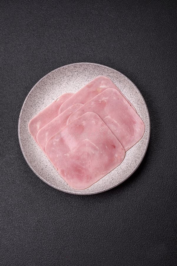 Boiled Ham Cut into Square Slices with Sorrel and Spices Stock Photo ...