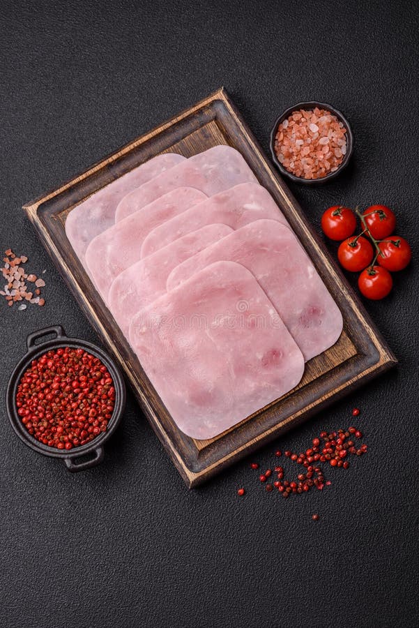 Boiled Ham Cut into Square Slices with Sorrel and Spices Stock Photo ...