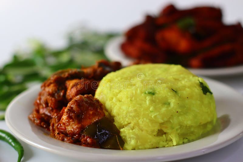 Boiled and Mashed Tapioca Served with Spicy Chicken Curry and Crispy ...